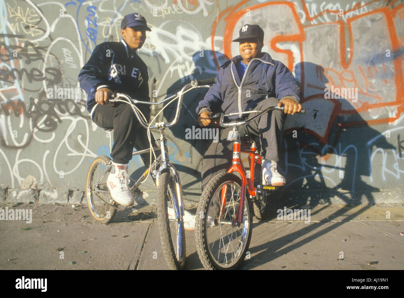 Two inner city African American teenagers on bicycles NY City Stock ...