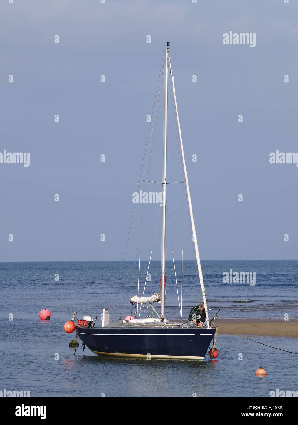 Yacht with blue sails hi-res stock photography and images - Alamy