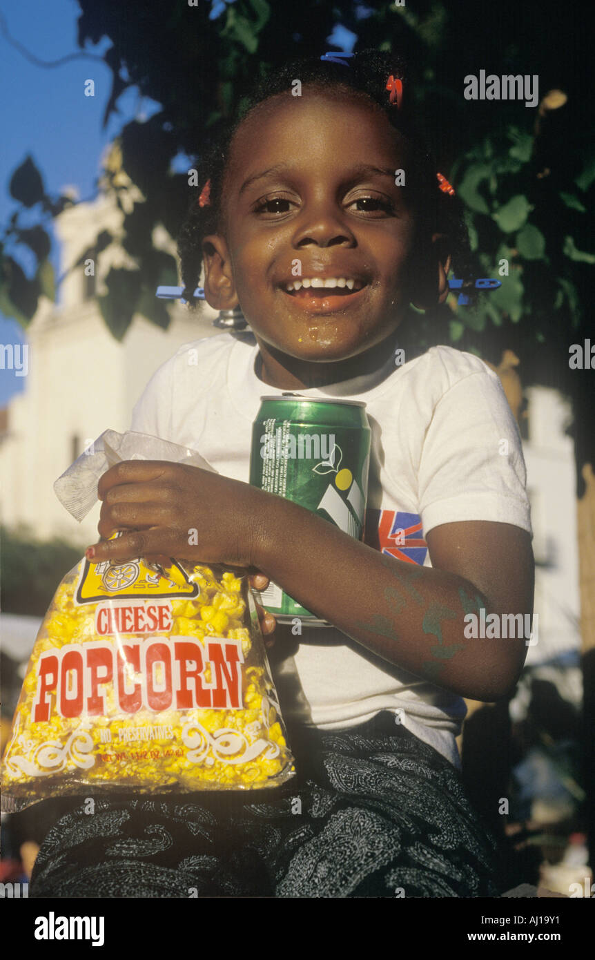 An African American child eating snack food Stock Photo - Alamy