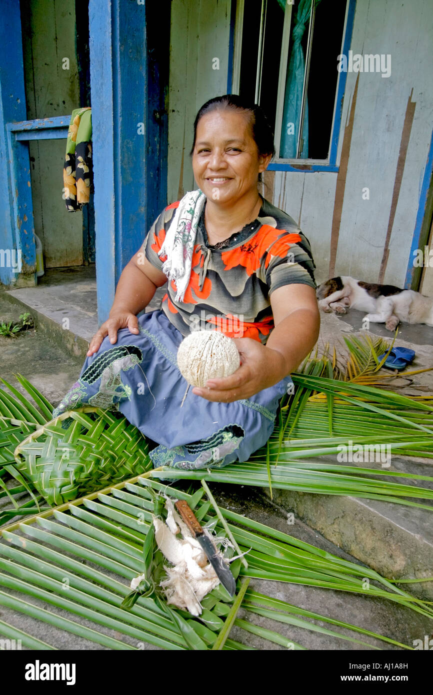 Native Kosrae woman offers just shucked coconut to visitor while ...