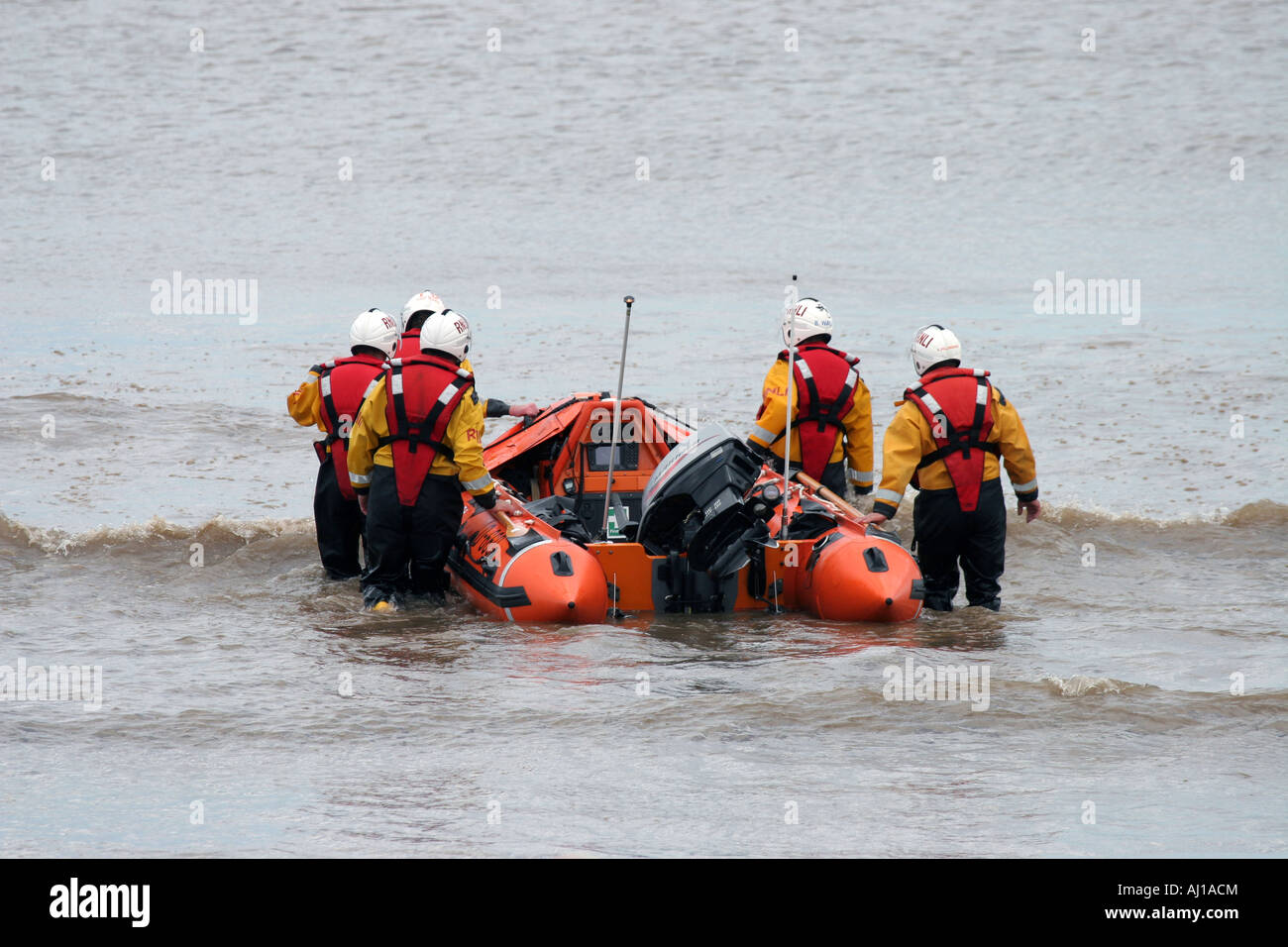 RNLI manual launch of dinghy Stock Photo - Alamy