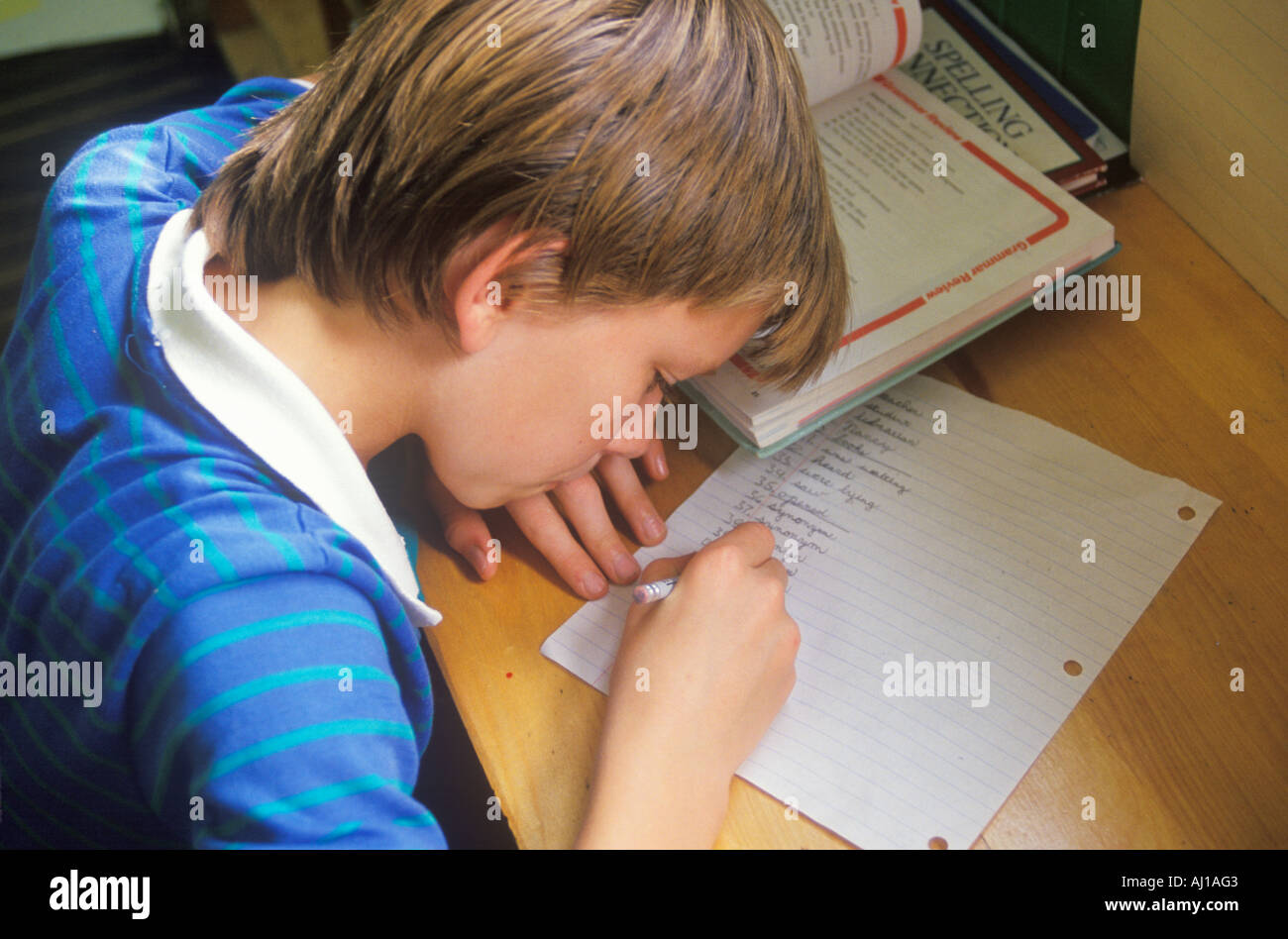 A boy doing his homework Stock Photo - Alamy