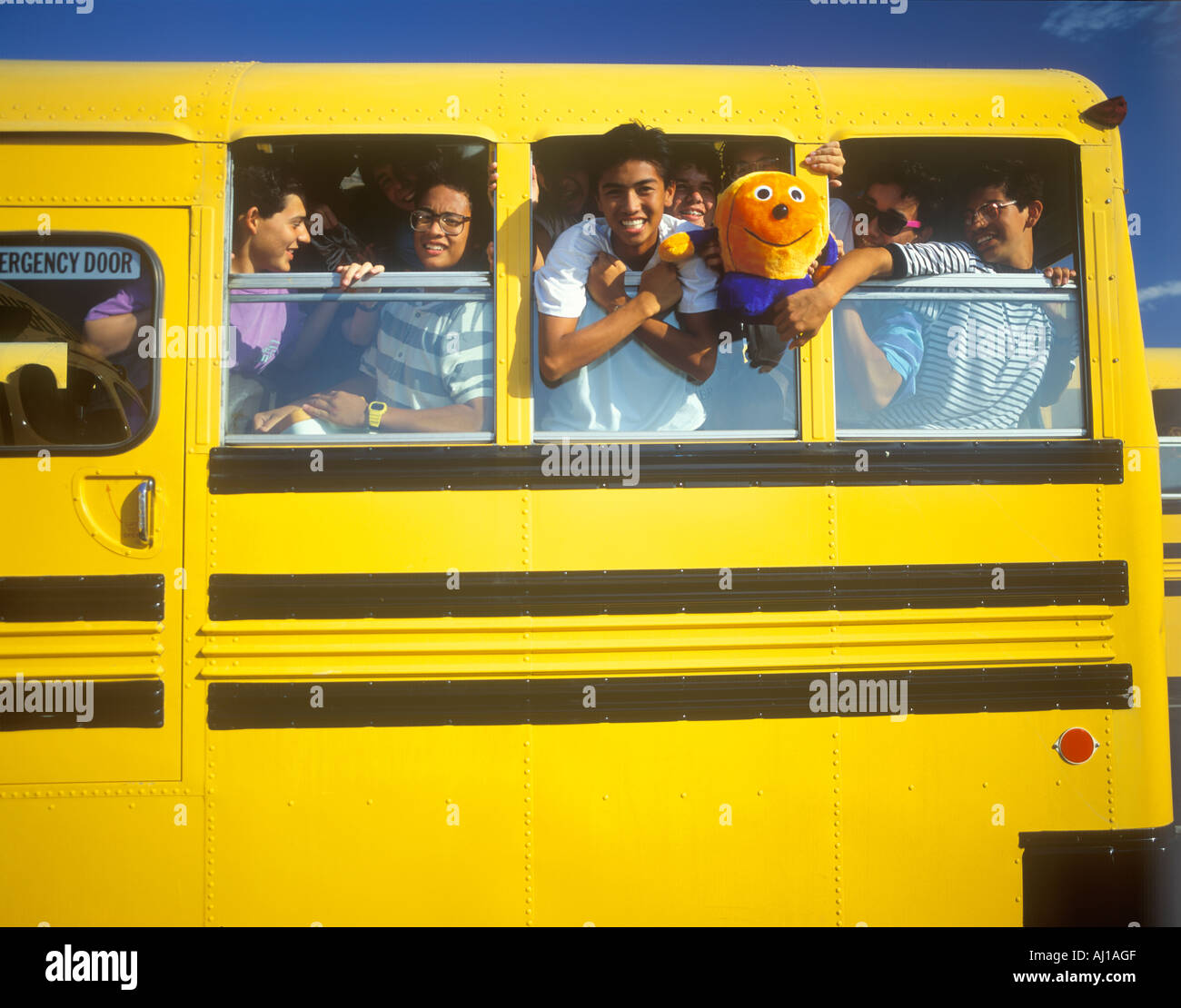 Schoolboys in a yellow schoolbus Stock Photo - Alamy