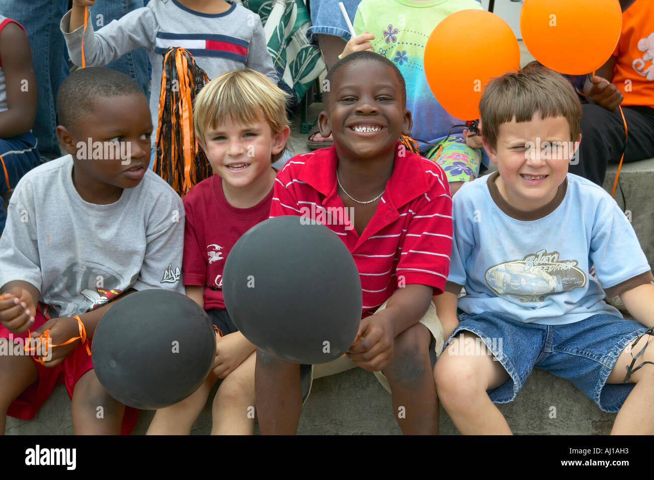 Children smiling and holding balloons at parade in Central GA Stock ...