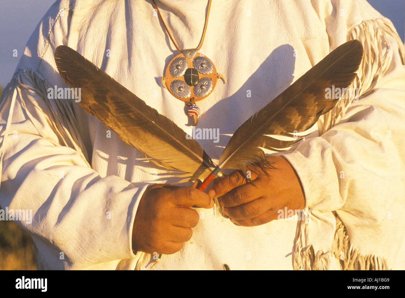 Close up of a Native American holding ceremonial feathers Big Sur CA ...