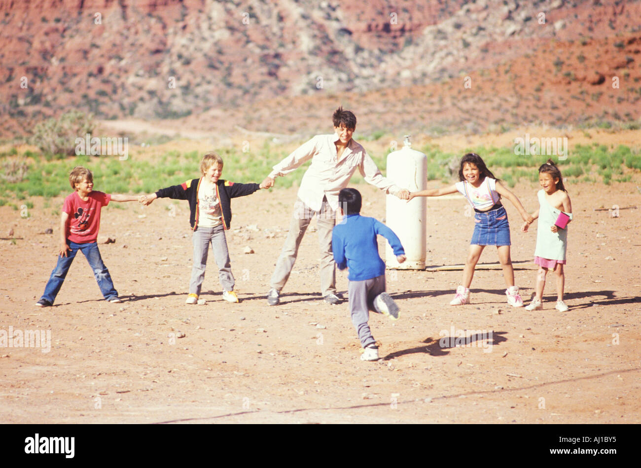 Teacher and children playing a game Lee Ranch Stock Photo - Alamy