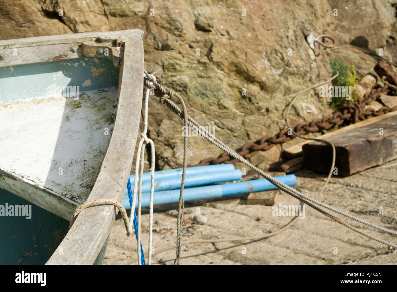 The prow of a small dinghy on a concrete launching ramp Stock Photo - Alamy