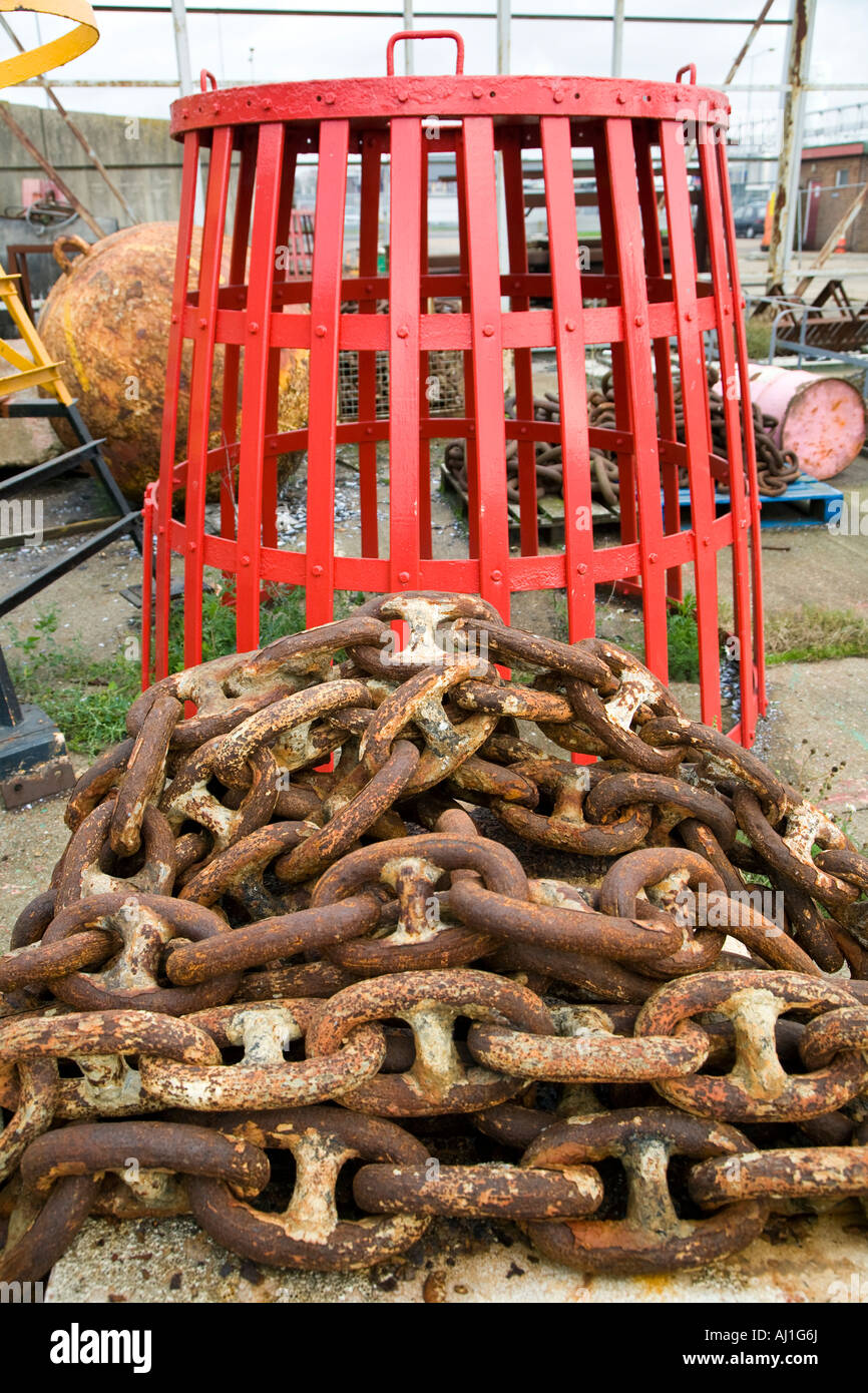 Large braced rusty chain link with red navigation buoy cage Stock Photo ...
