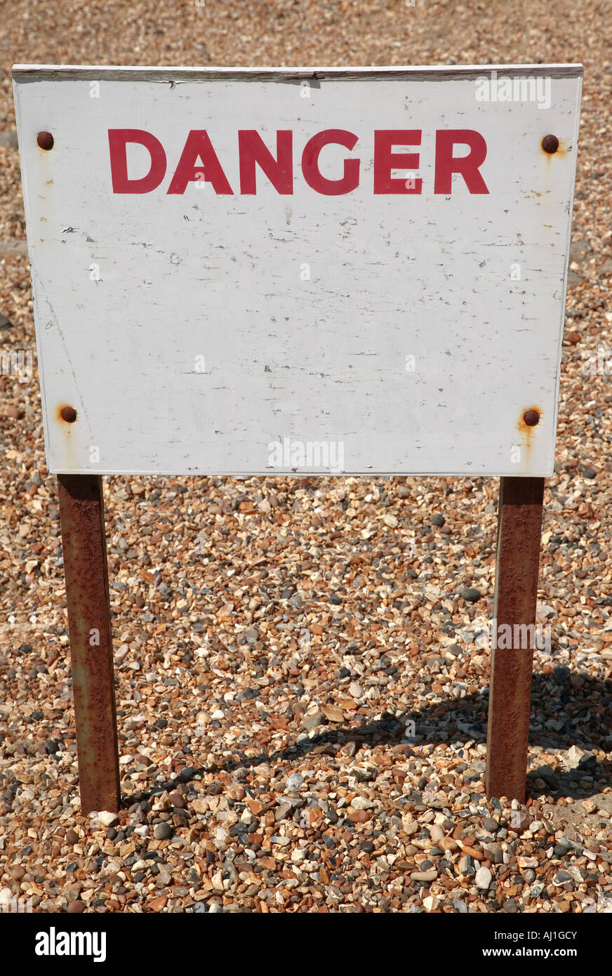 Old weathered sign with the word Danger the rest is blank for your own ...