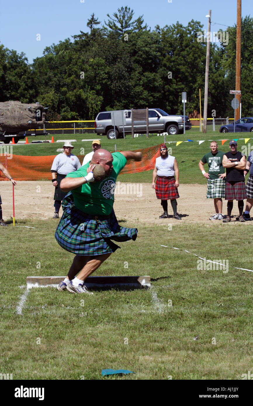 Stone put man throwing stone highland hi-res stock photography and ...