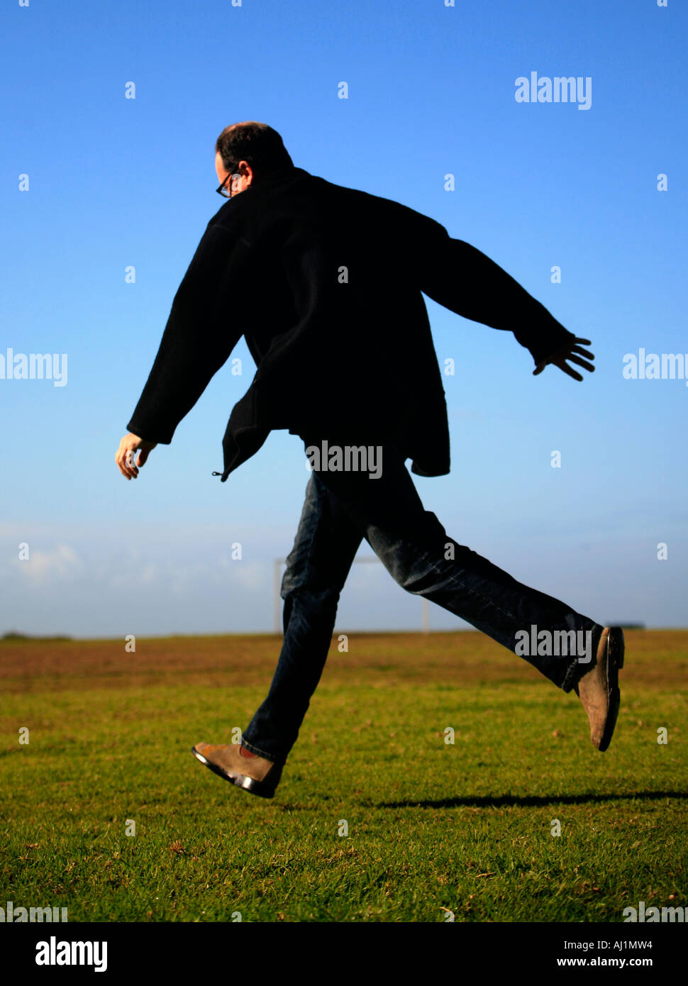 Running black man hi-res stock photography and images - Alamy