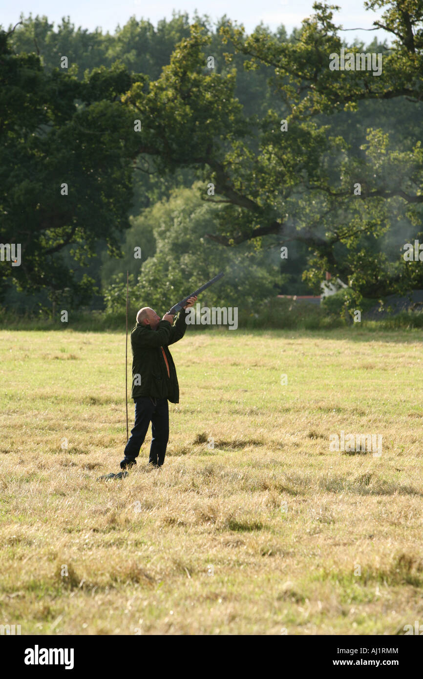 man shooting at driven shoot, countryside sport uk Stock Photo - Alamy