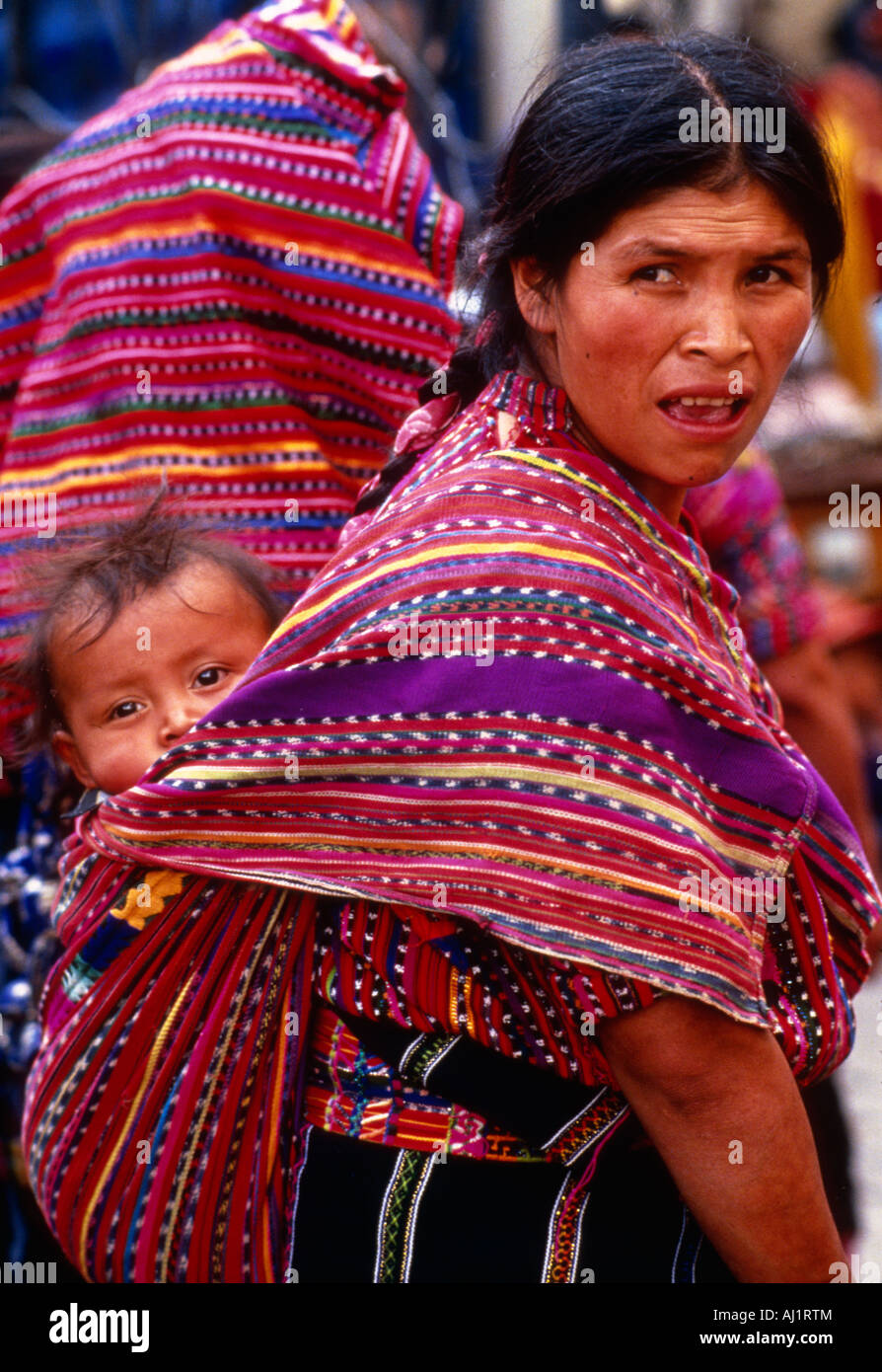 Woman carrying child on back in Guatemala Stock Photo - Alamy