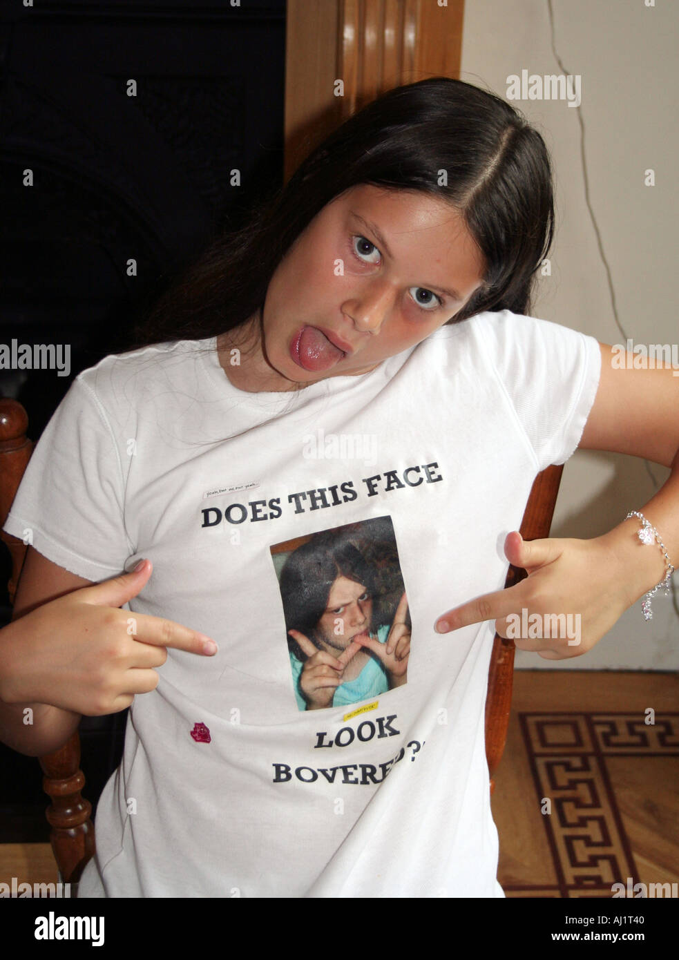 Young girl with yobbish attitude looking not so bovered Stock Photo - Alamy