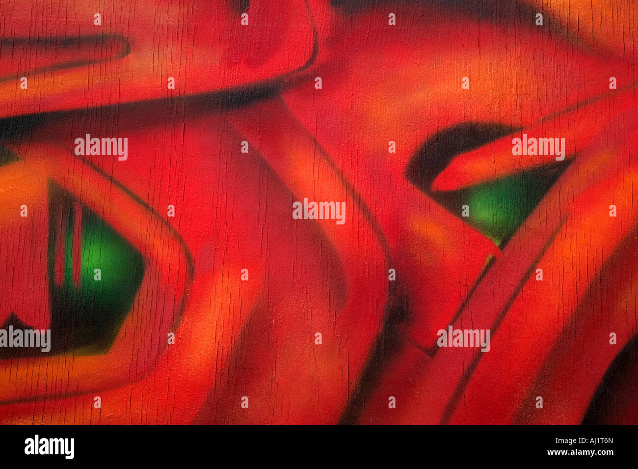 Dark intense red graffiti on a weathered wooden background Stock Photo ...