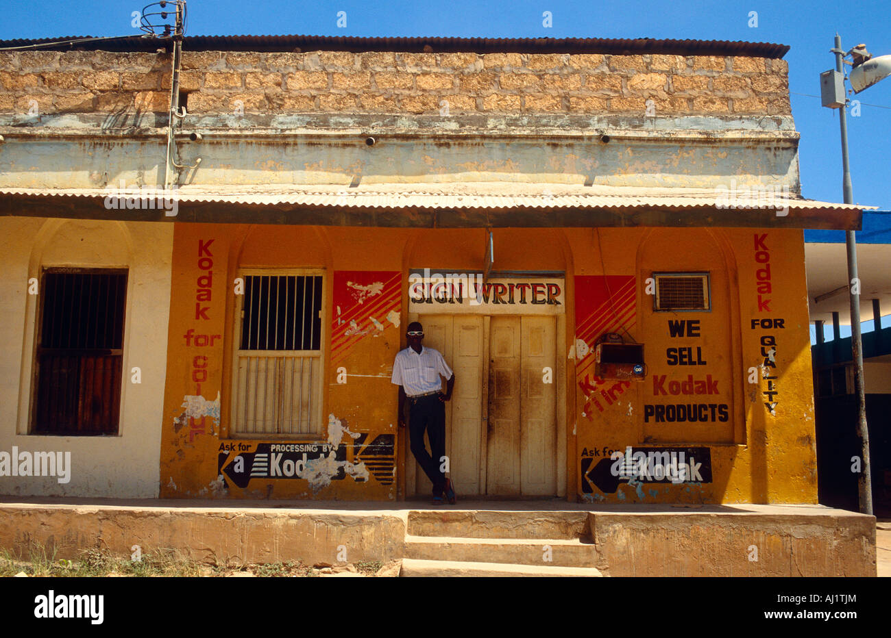 Kodak shop man signs africa Stock Photo - Alamy