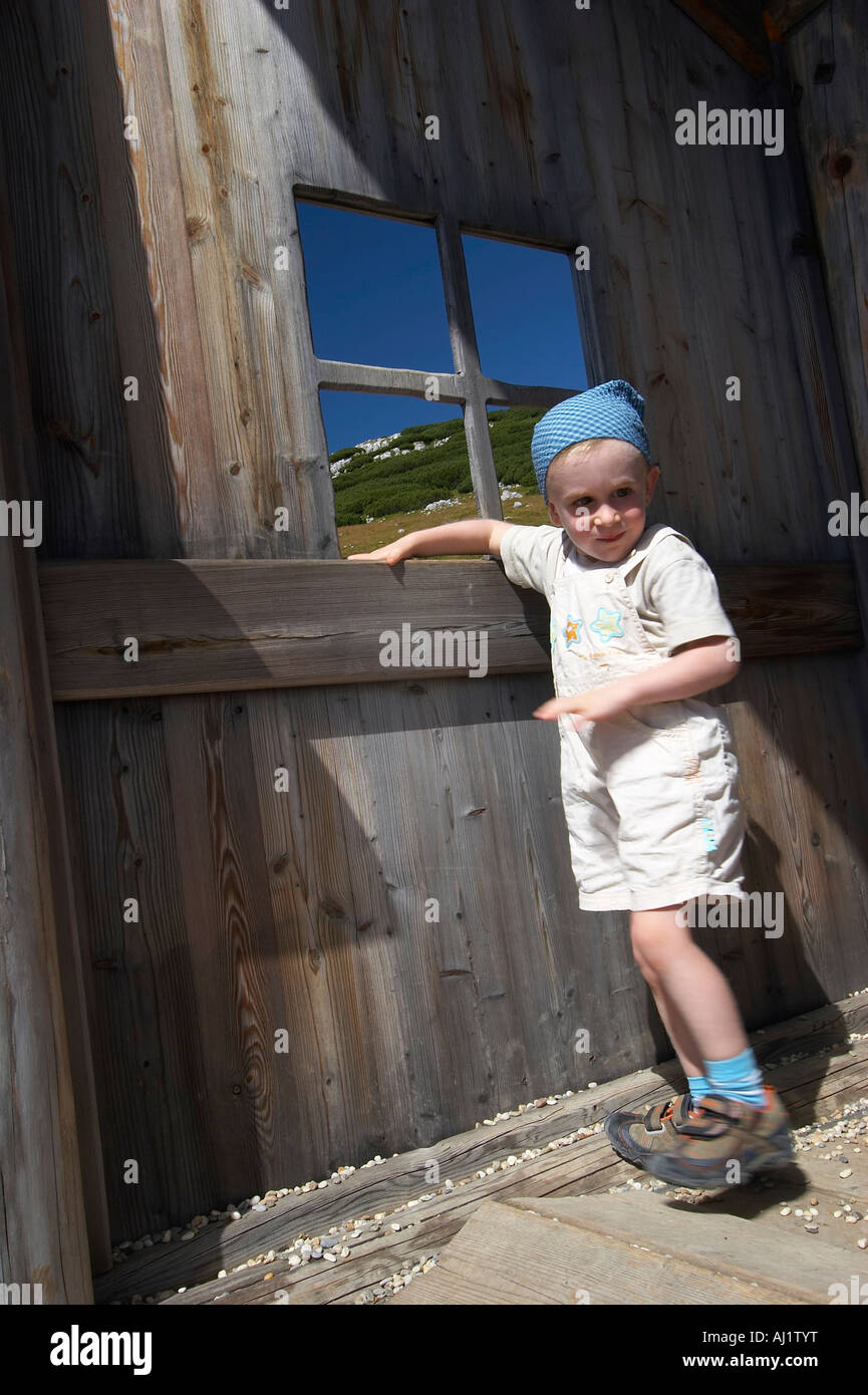 baby in wooden cabin with window Stock Photo - Alamy