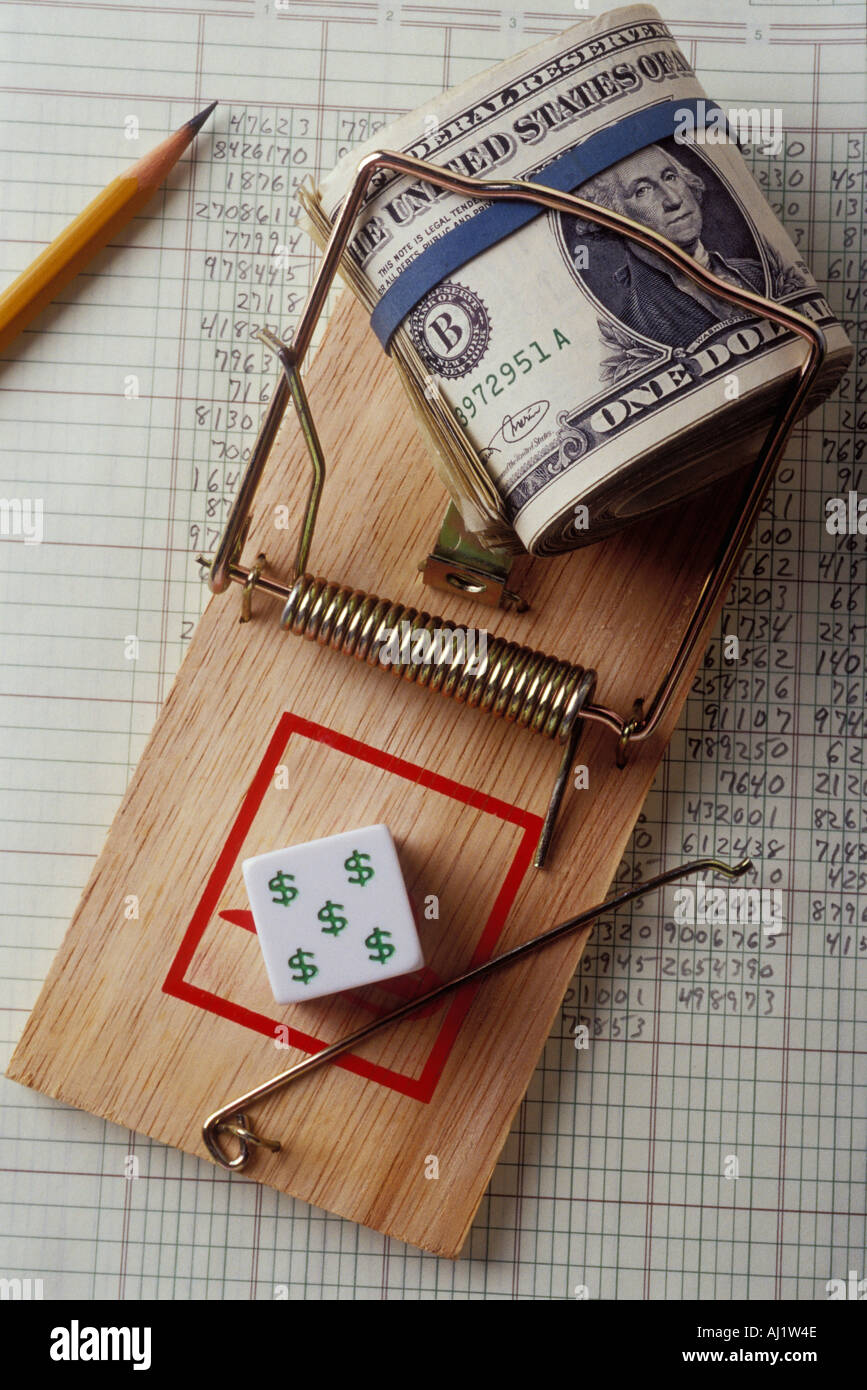 Money and dice on mouse trap Stock Photo - Alamy
