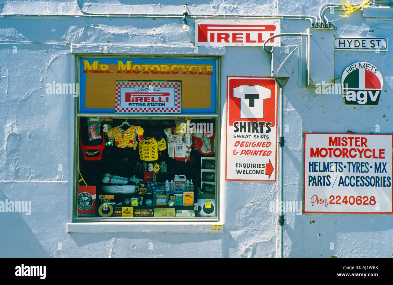 motorcycle shop window with signs Stock Photo - Alamy