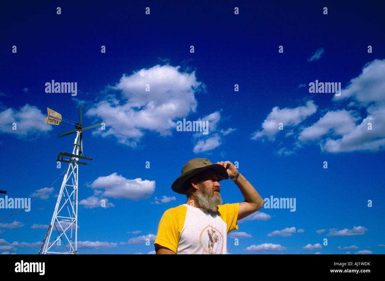 Australia outback man bush wind turbine Stock Photo - Alamy