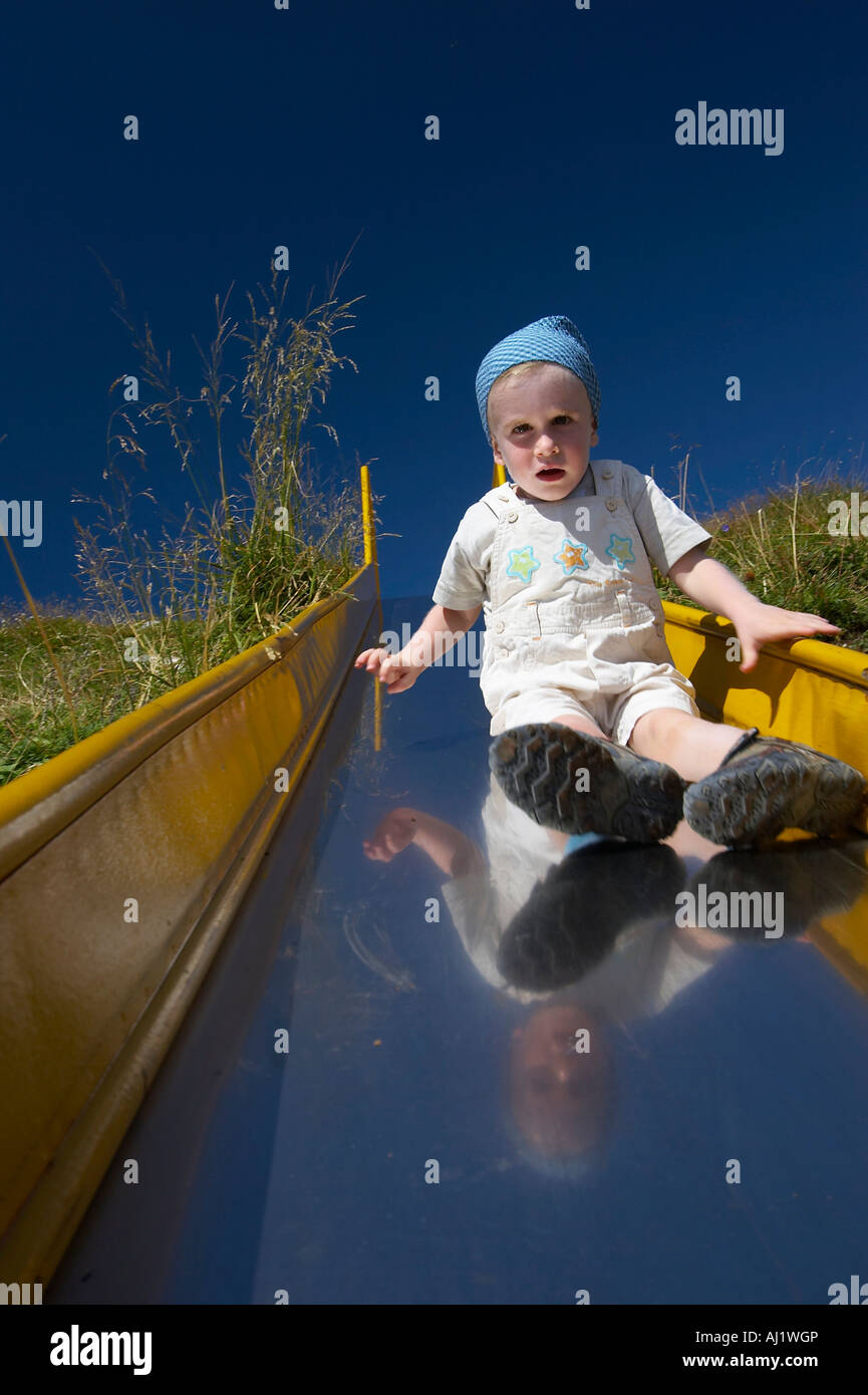 little boy on slide Stock Photo - Alamy