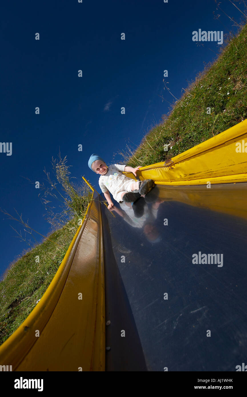 little boy on slide Stock Photo - Alamy