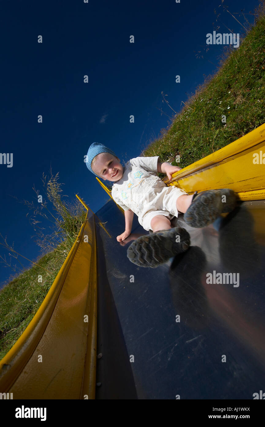 little boy on slide Stock Photo - Alamy