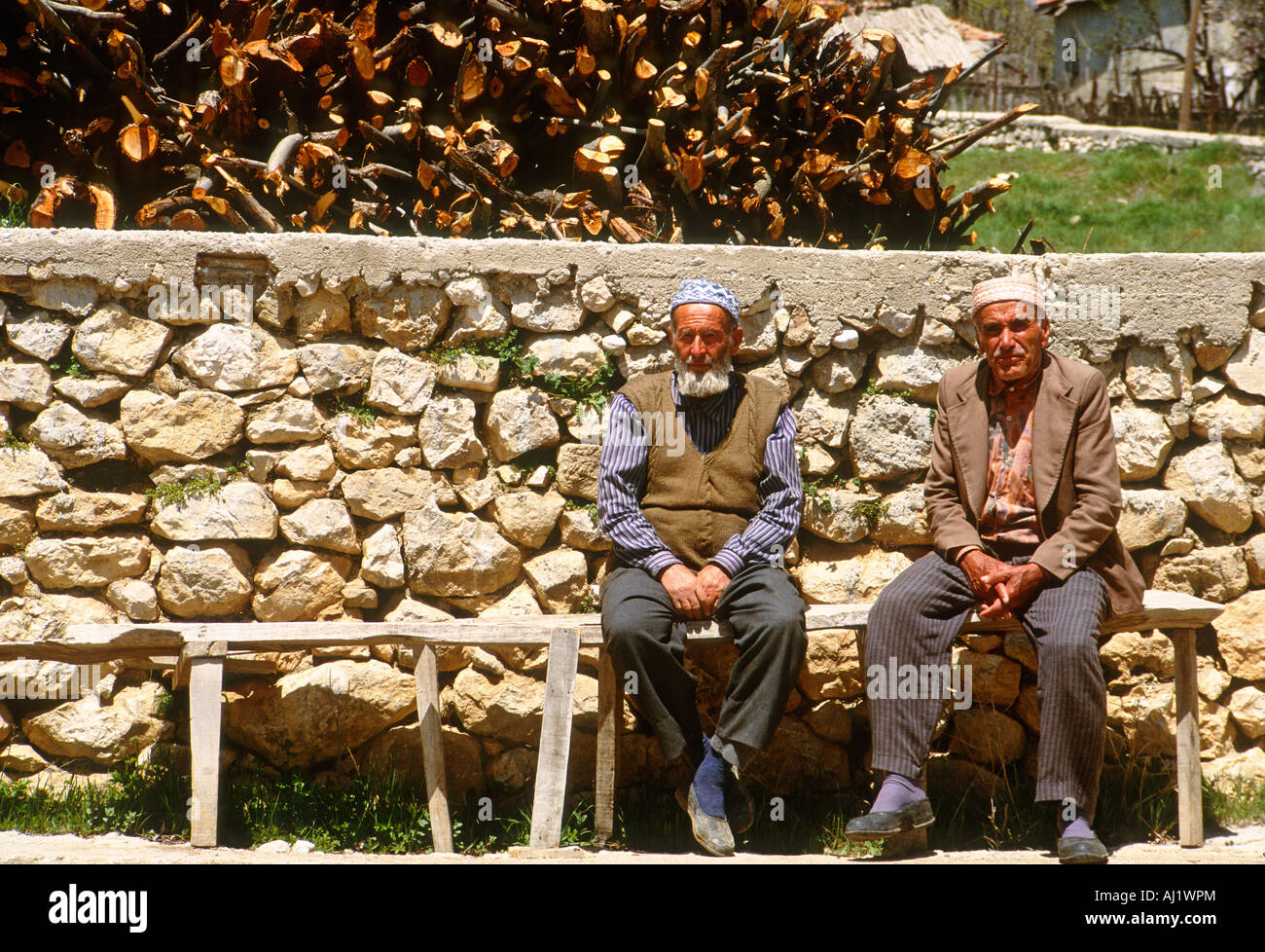 two elderly Turkish farmers sitting on a bench Stock Photo - Alamy