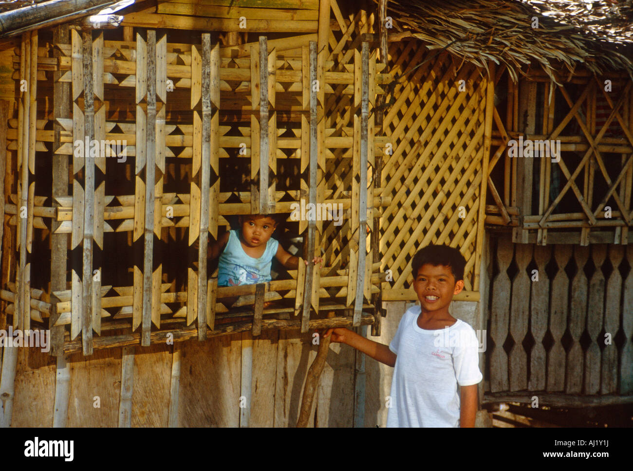 two boys straw hut phillippines Stock Photo - Alamy