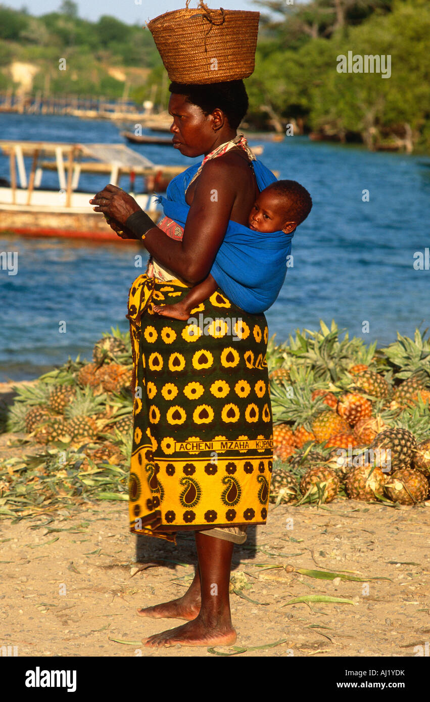Kenyan mother with baby on her back Stock Photo - Alamy