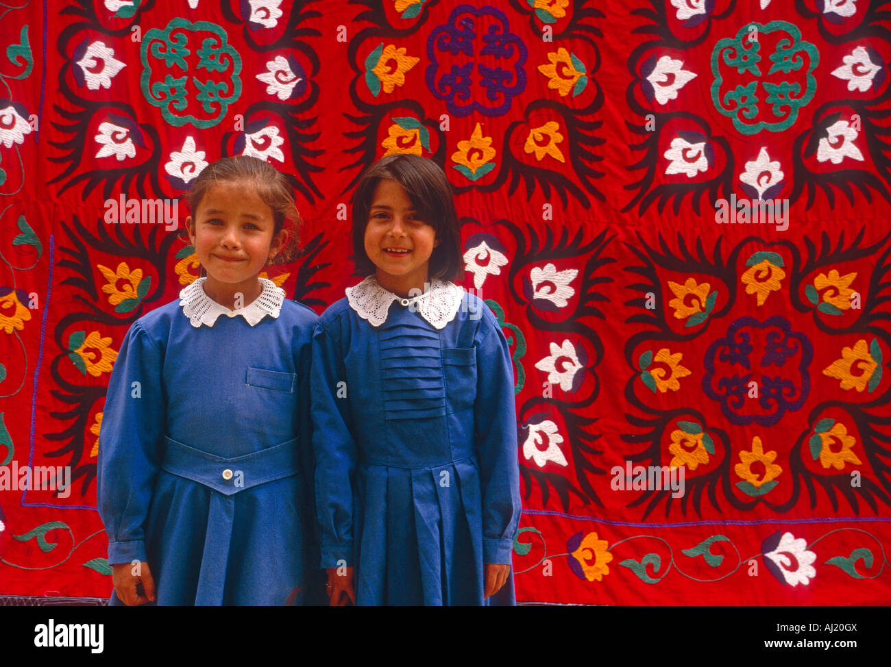 two young Turkish girls in front of traditional embroidered cloth Stock ...