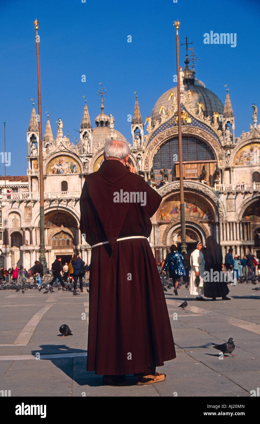 monk taking photograph of St Marks Venice Stock Photo - Alamy