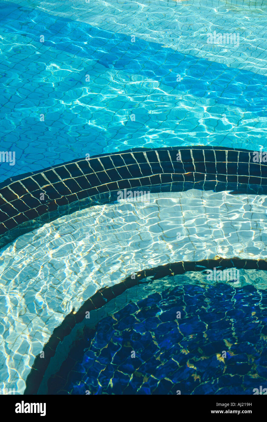 Corner of swimming pool with water and reflections Stock Photo - Alamy