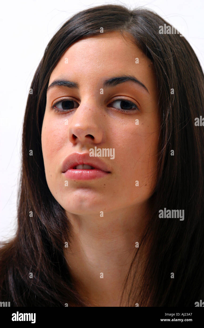 Headshot of young woman with long straight black hair looking at the ...