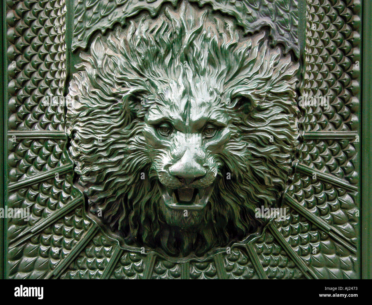 Green metal lion head fountain Stock Photo - Alamy