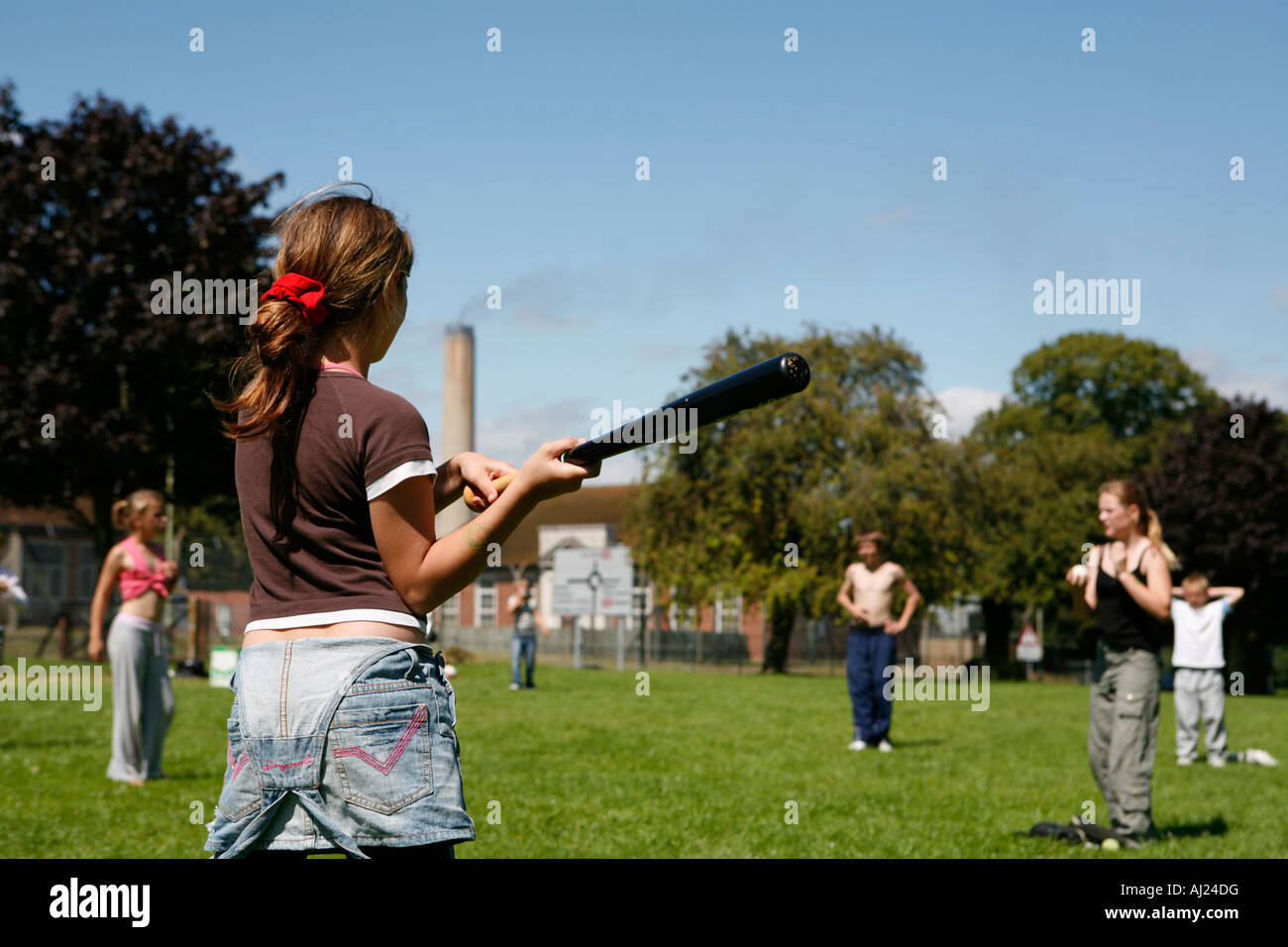 Girl playing baseball Stock Photo - Alamy