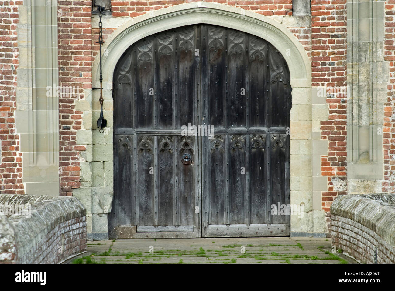Studded wooden Elizabethan Door Bell pull Stock Photo - Alamy