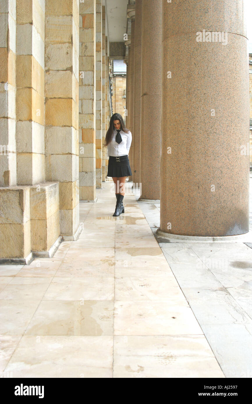 Long corridor with columns and schoolgirl on the far end Stock Photo ...