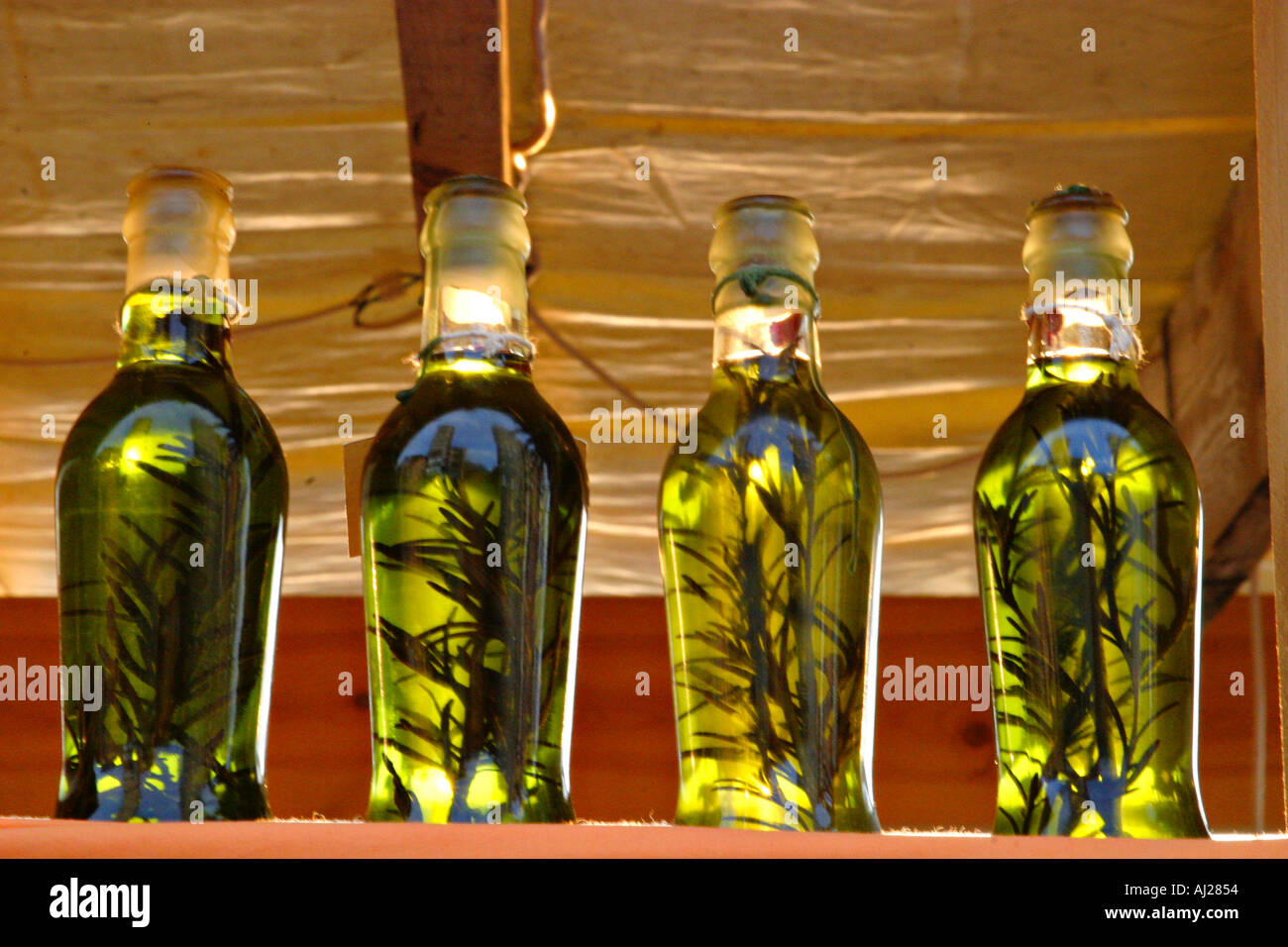 Natural olive oil bottles on display in a street stand Stock Photo - Alamy