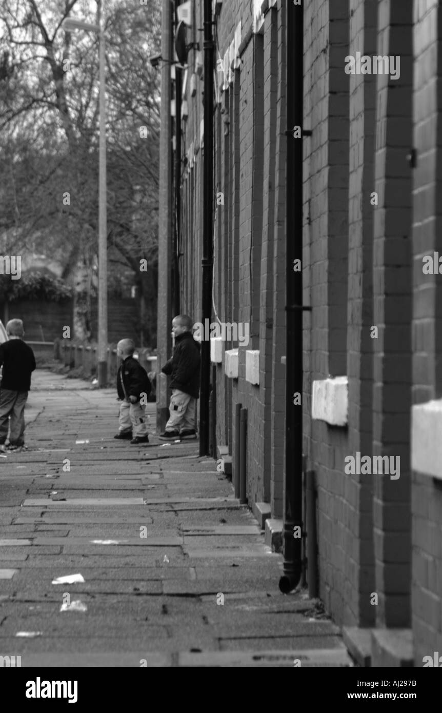 Young boys play on a terraced street in Salford Manchester England in ...
