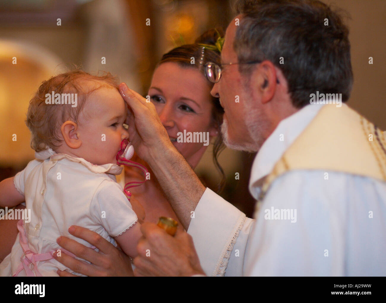 priest blessing little girl Stock Photo - Alamy