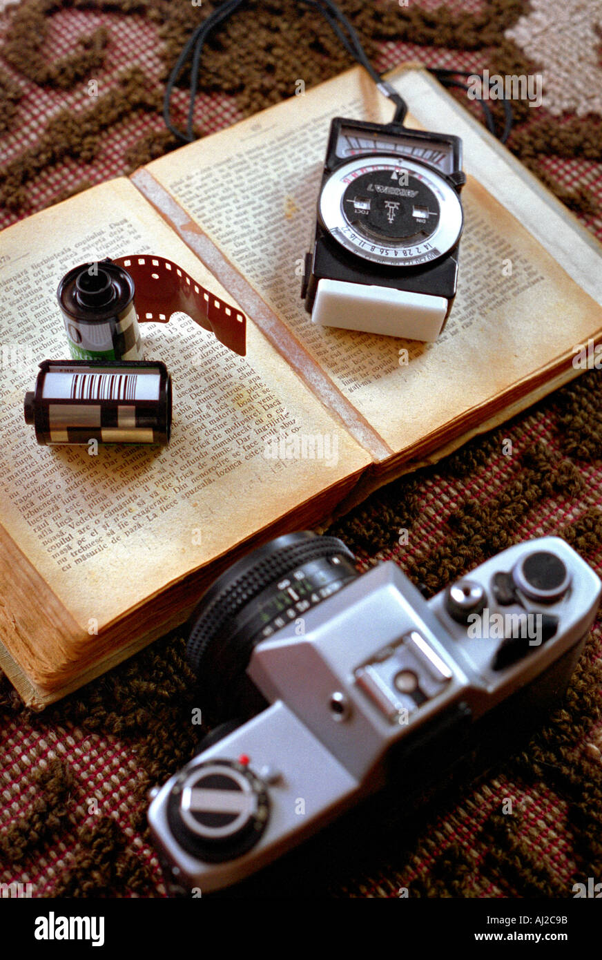 Still life with camera film exposure meter book Stock Photo - Alamy