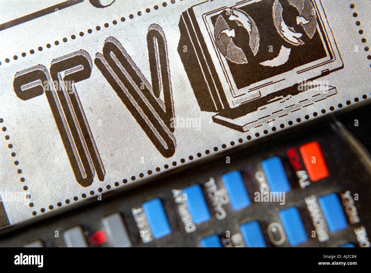 Remote control on newspaper Stock Photo - Alamy