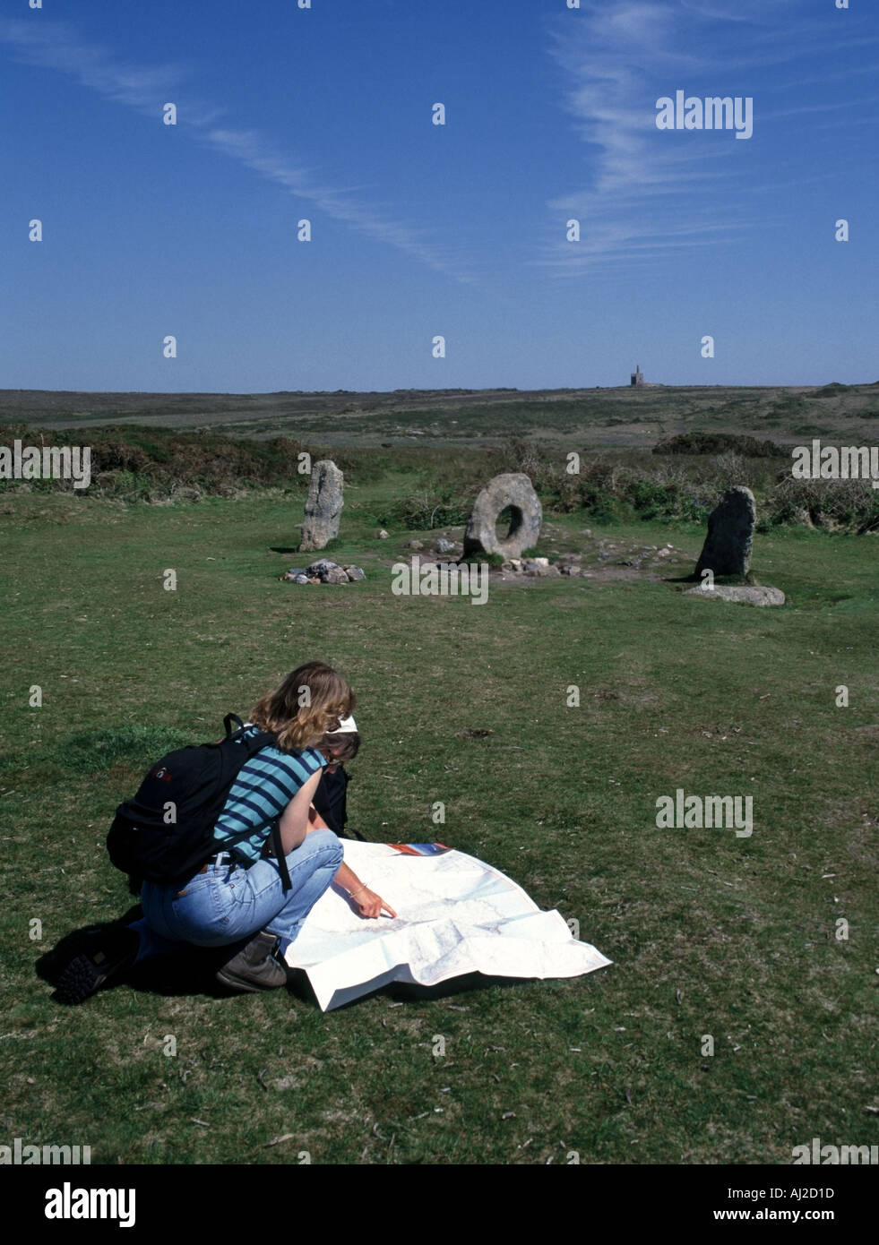 Men An Tol Cornwall ancient granite standing stones two walkers ...