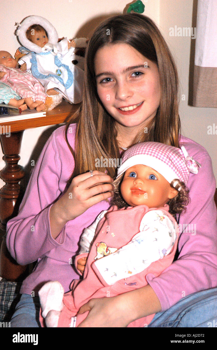 Nine year old girl with doll Stock Photo - Alamy Nine year old girl with doll Stock Photo - Alamy