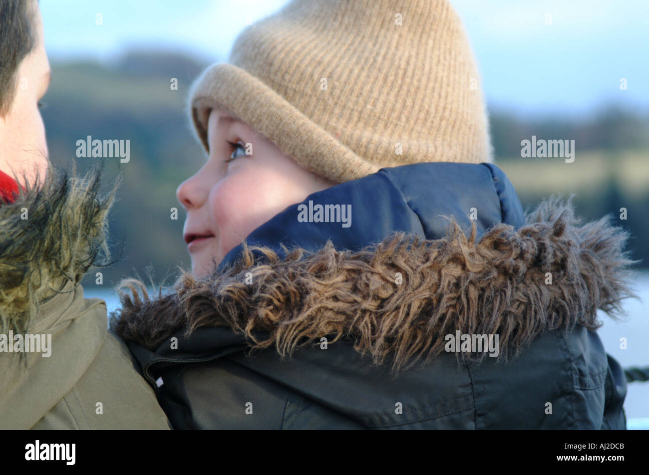 Two lads laughing wrapped up for cold weather Stock Photo - Alamy