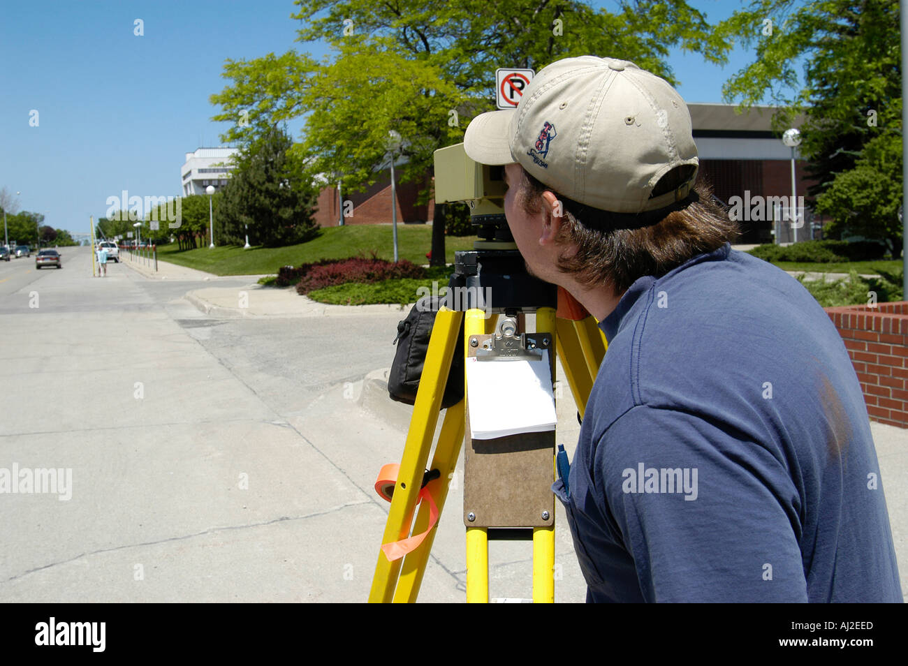 Adult Male Uses Laser Technology to Survey and Map Street Stock Photo ...