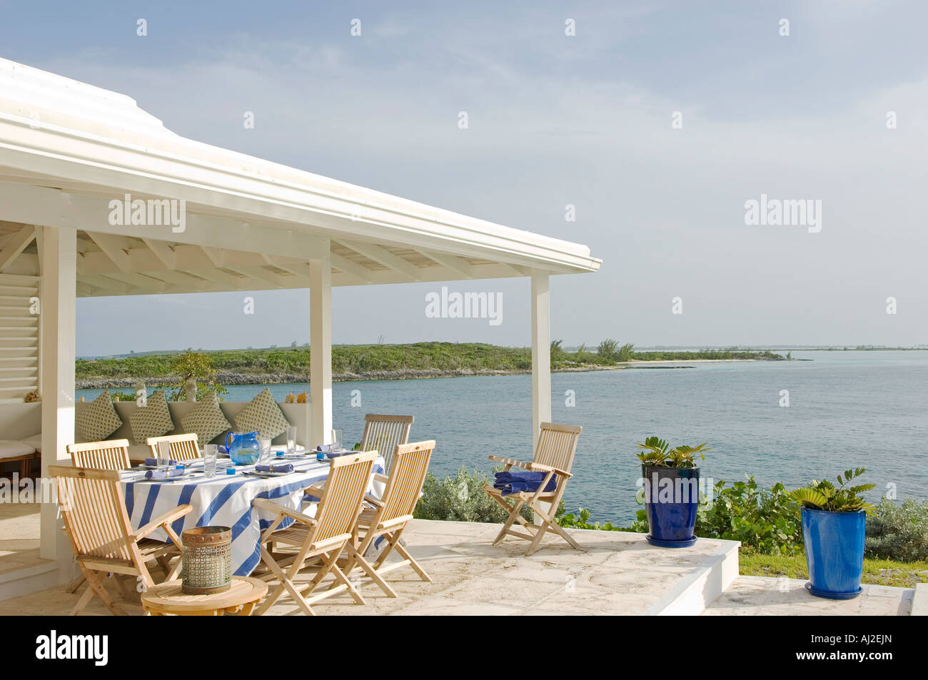Table laid for lunch by the swimming pool at Little Whale Cay Stock ...