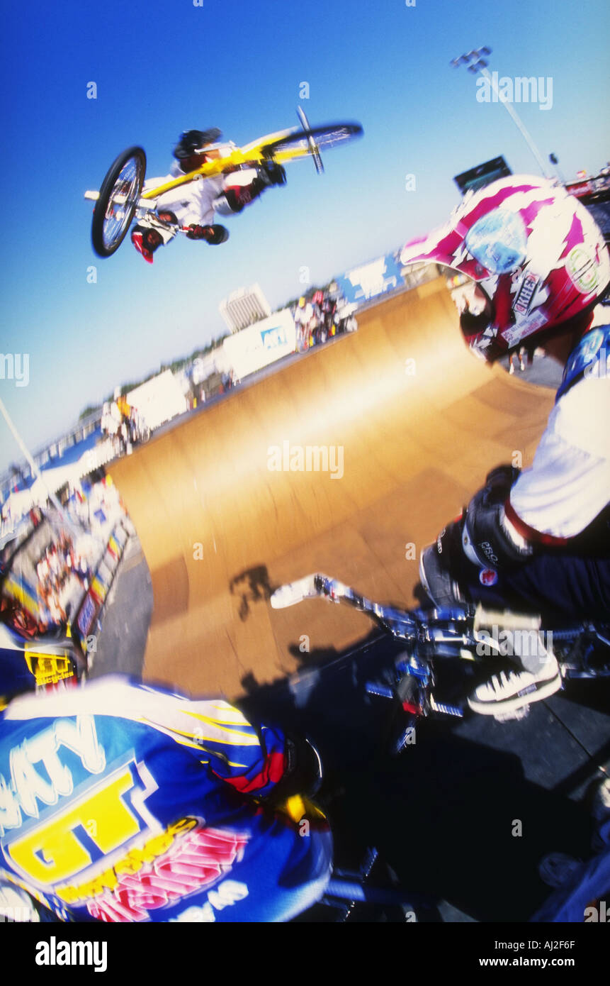 BMX bike riders on a half pipe ramp Stock Photo - Alamy