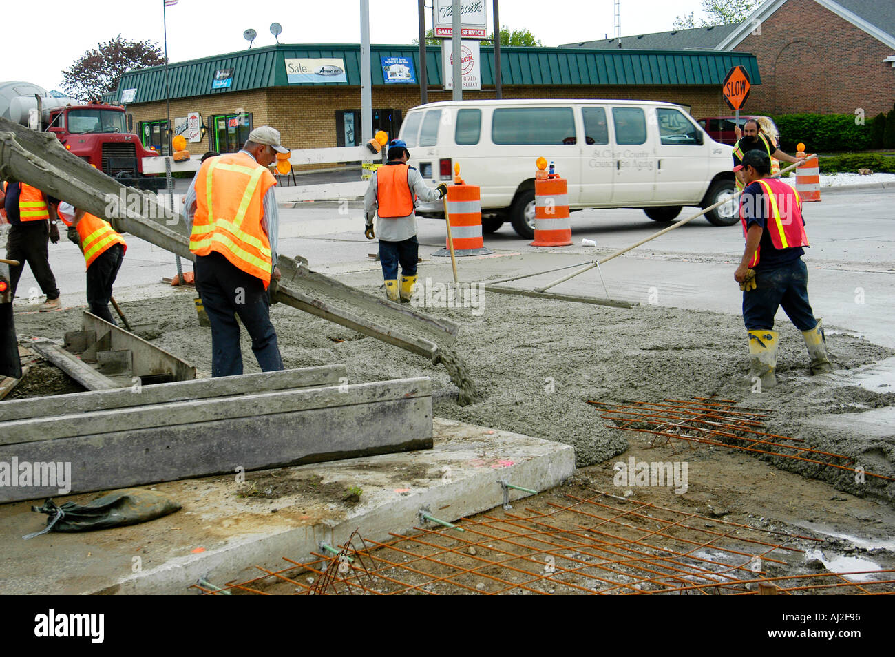 Workers Pour Cement in New Highway Construction Stock Photo - Alamy